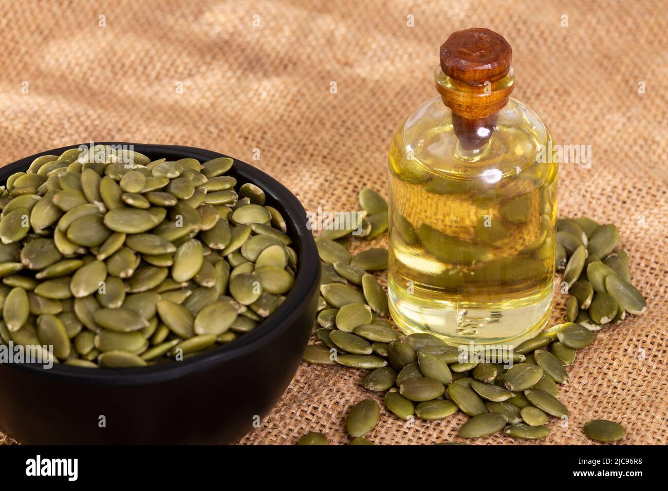 Organic Raw Shelled Pepitas And Pumpkin Seed Oil Stock Photo - Alamy