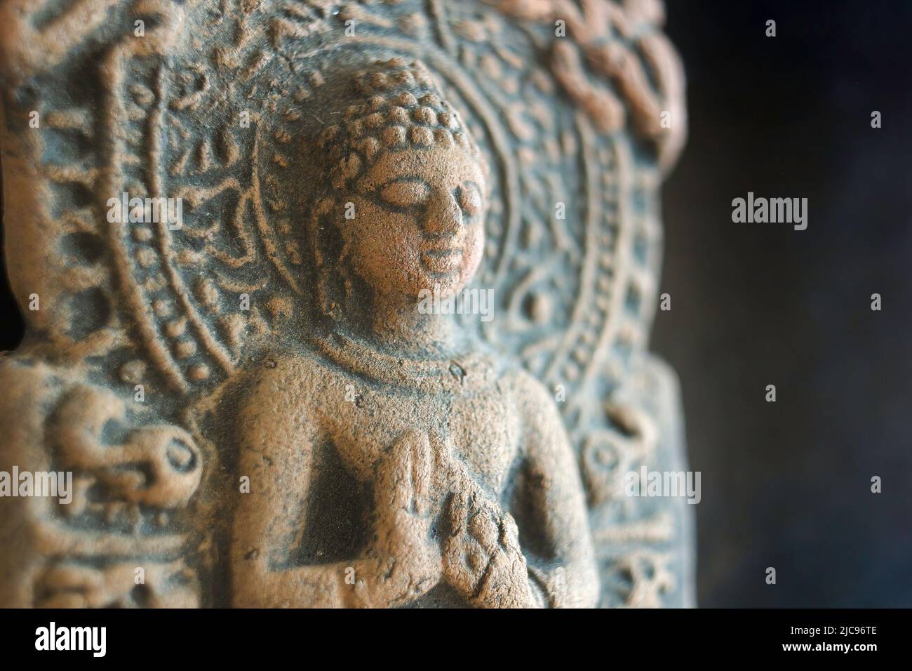 Close up macro of a meditating buddha stone statue Stock Photo - Alamy