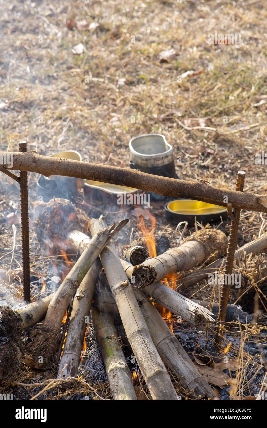 Man cooking over campfire in snow hi-res stock photography and images ...