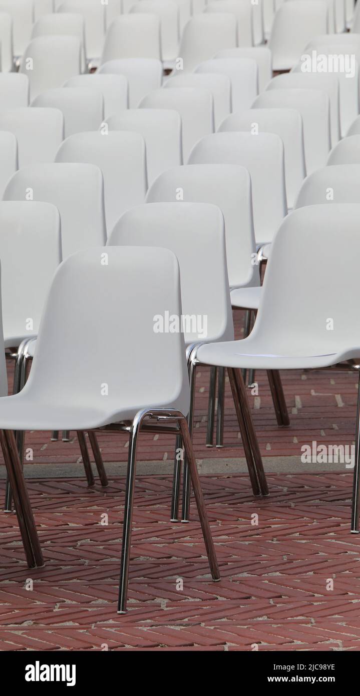 Many Empty white seats without people before the event Stock Photo - Alamy