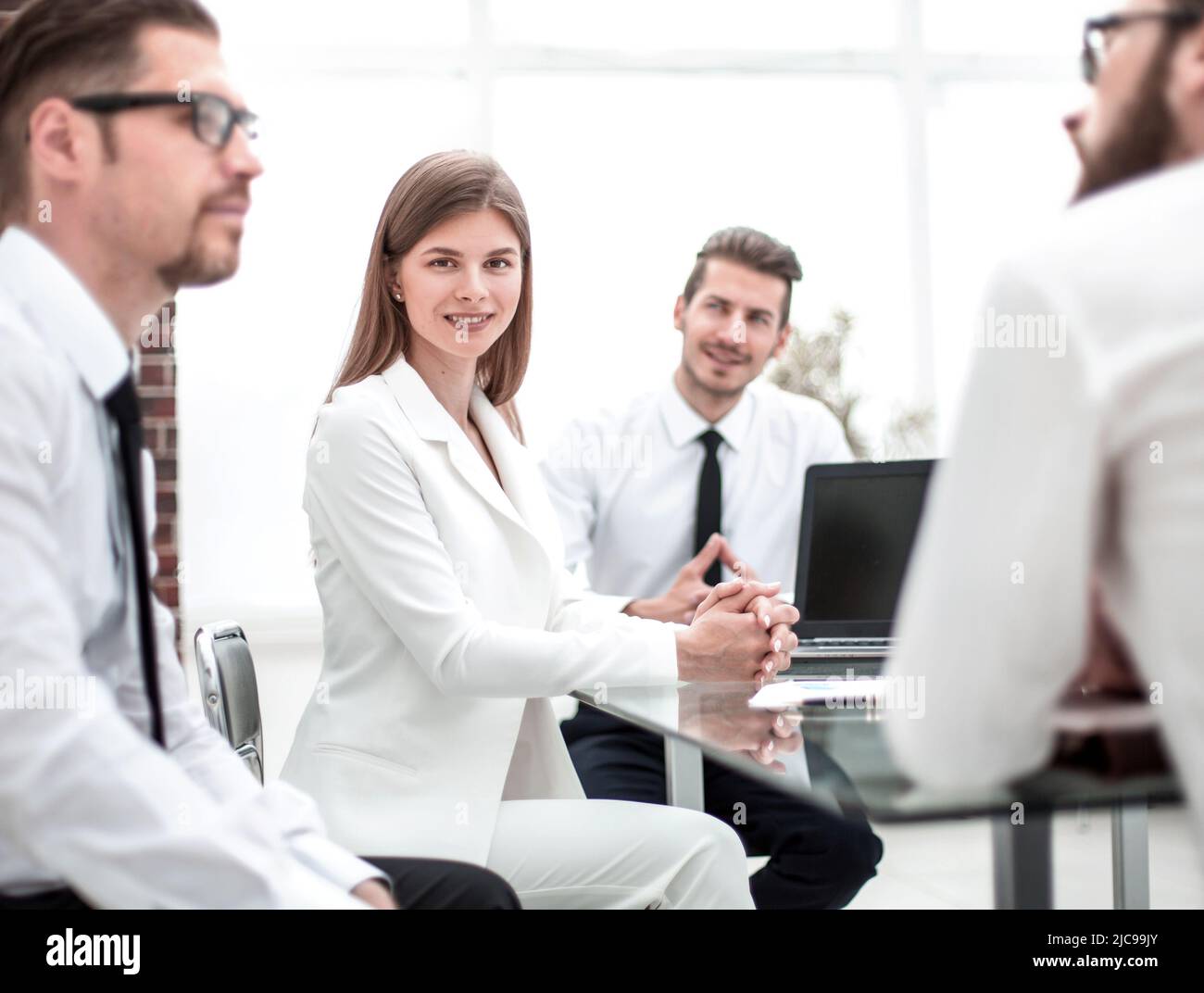 close up.business team sitting at the Desk Stock Photo - Alamy