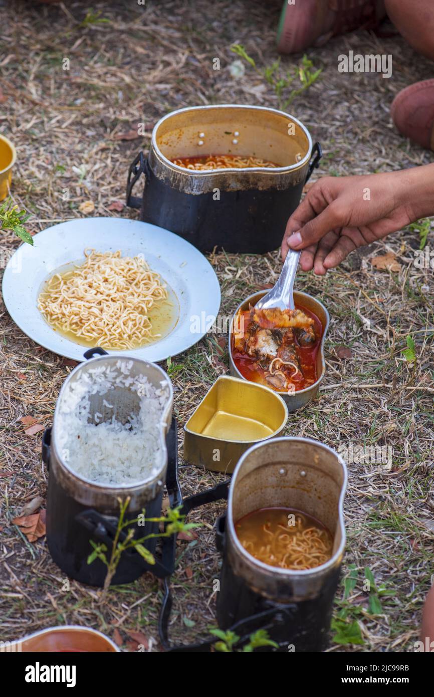 Camping and cooking food on vacation of children in rural areas Stock ...