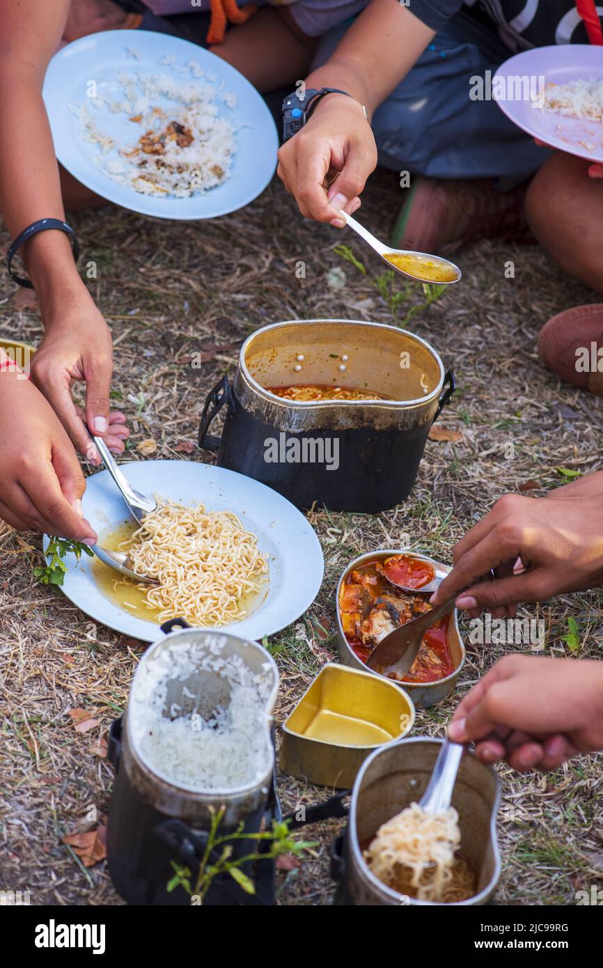 Camping and cooking food on vacation of children in rural areas Stock ...