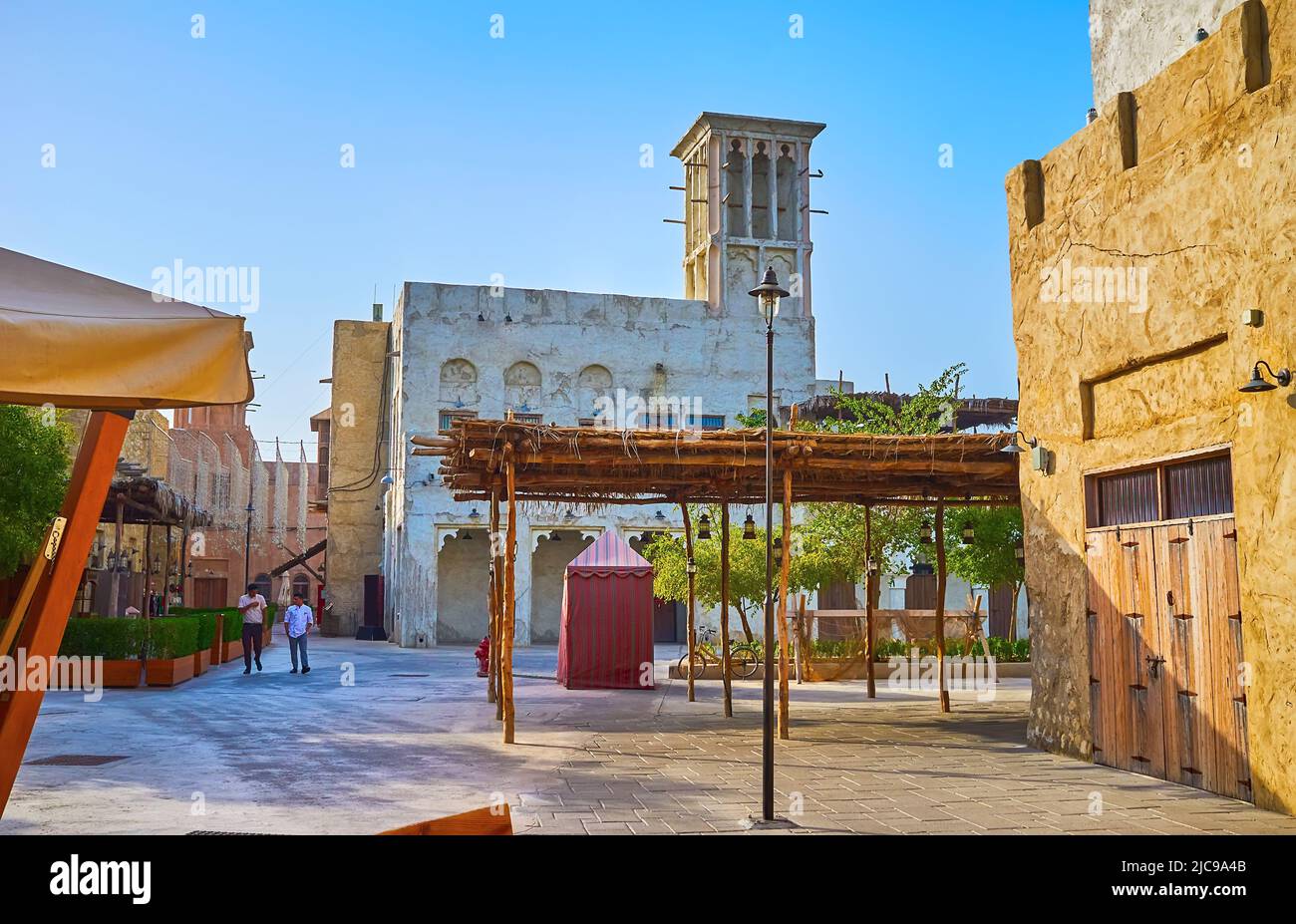 Traditional aobe houses with barjeel windcatchers, wooden terraces and ...