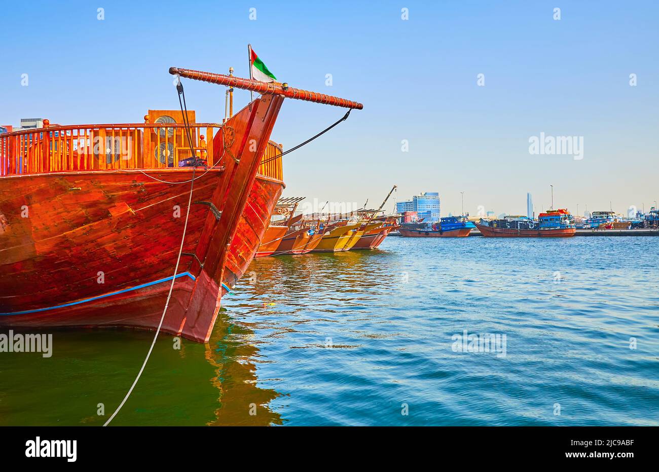 Lots of moored wooden classic dhow cruise boats on Dubai Creek, UAE ...