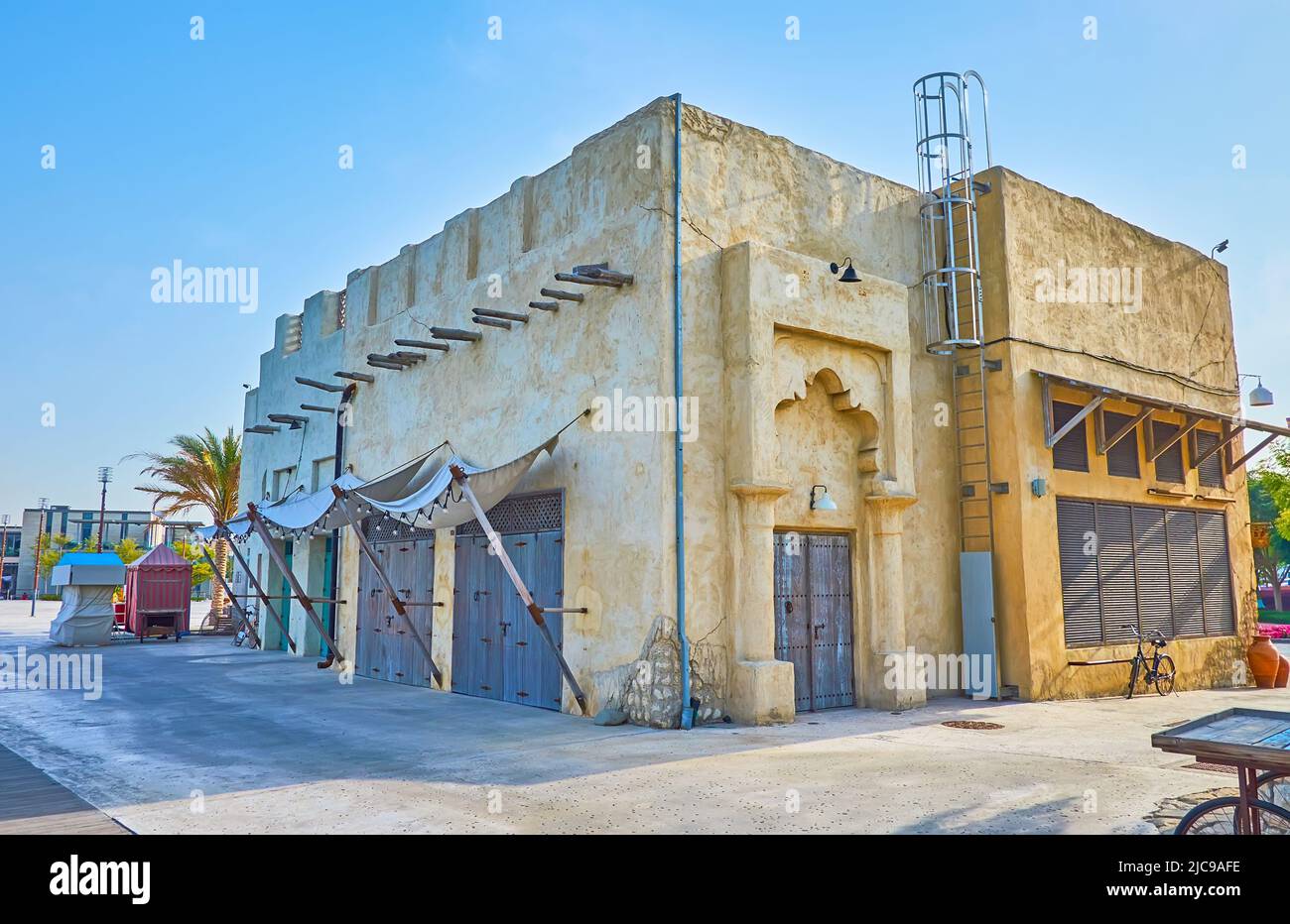 Historic adobe warehouse nowadays houses tourist shops and cafes of Al ...