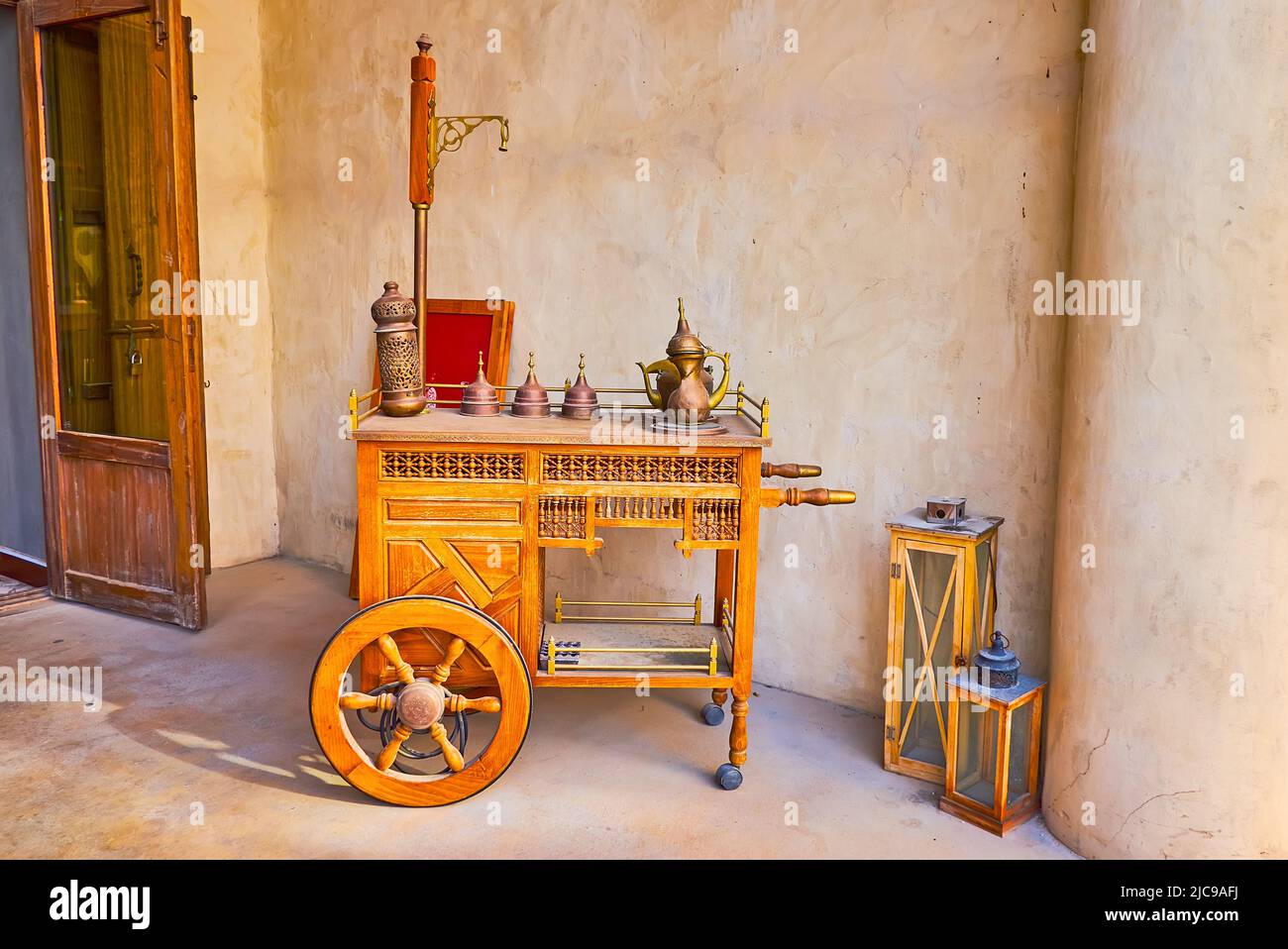 Traditional wooden Arabic coffee trolley with dallah coffee pot and ...