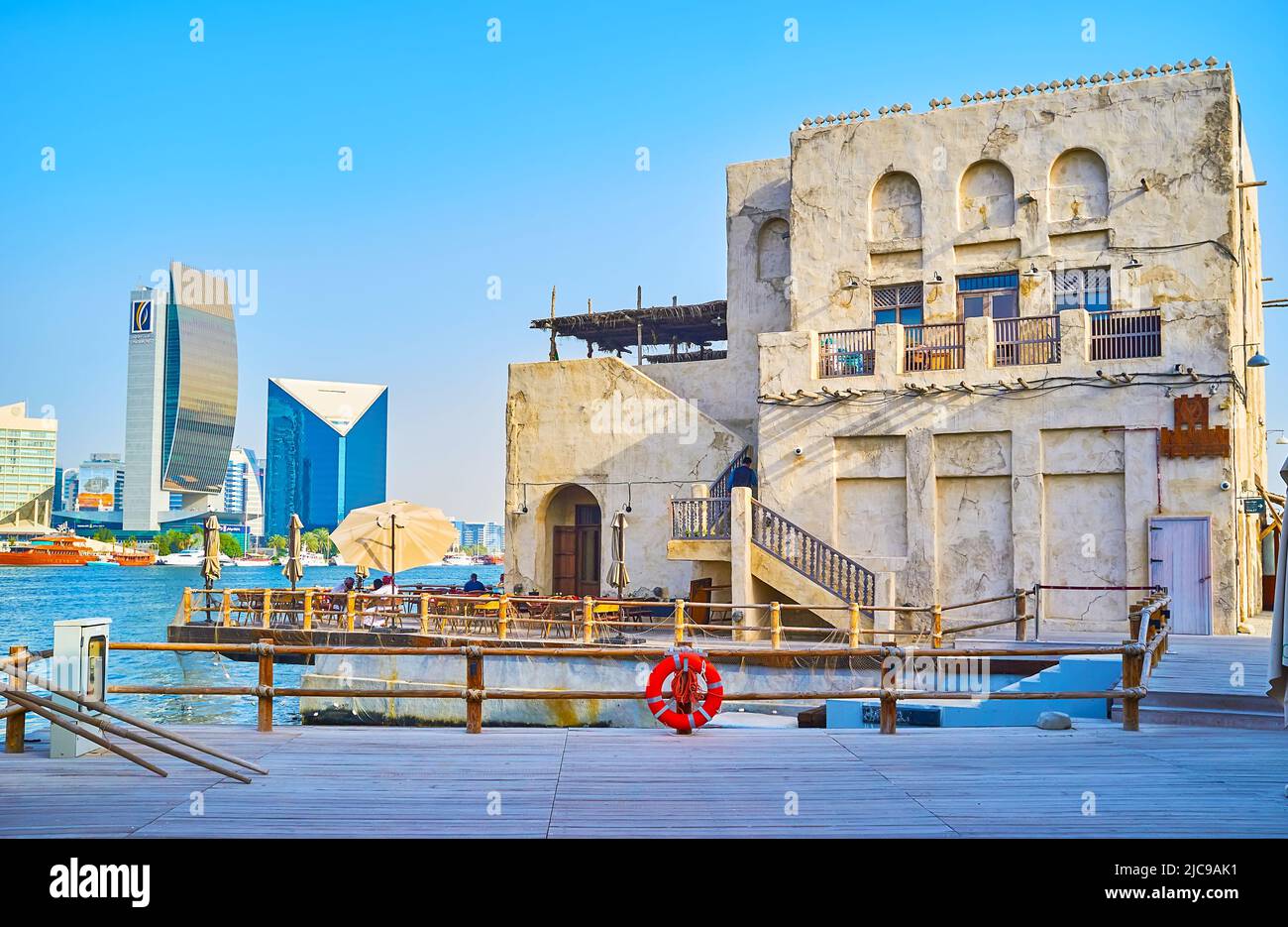 DUBAI, UAE - MARCH 1, 2020: The bank of Al Seef neighborhood with a view on vintage adobe house ...