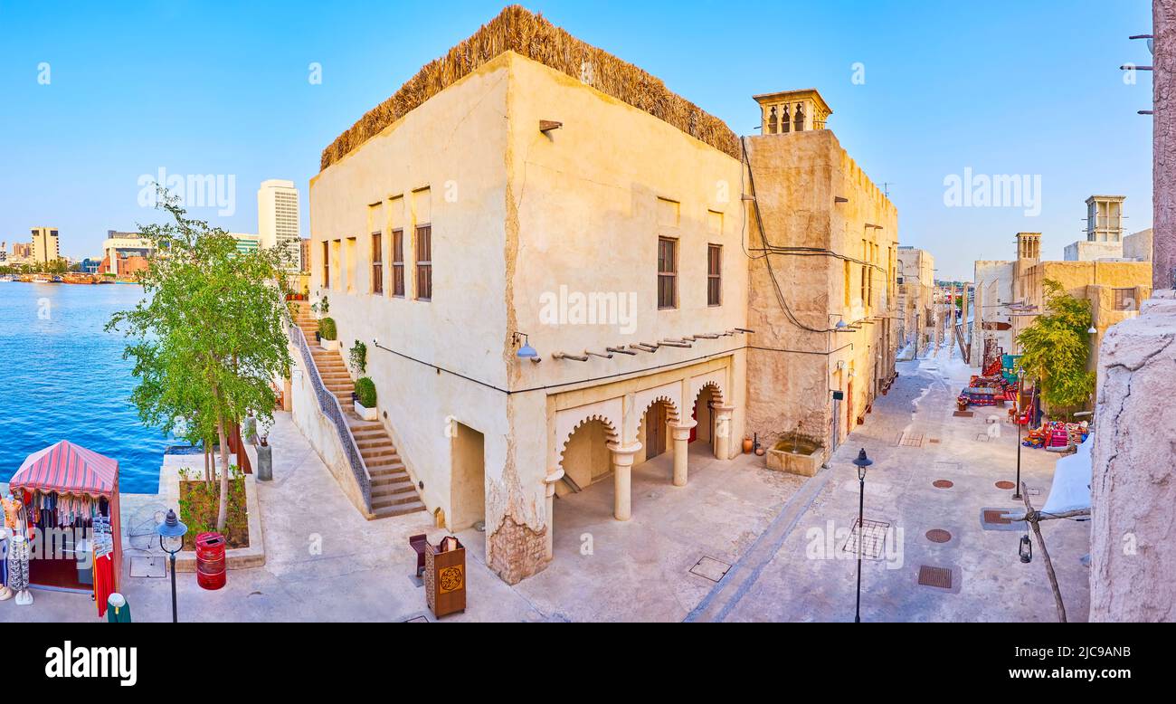 Panorama of Al Seef neighborhood adobe housing and narrow strees, stretching along Dubai Creek ...