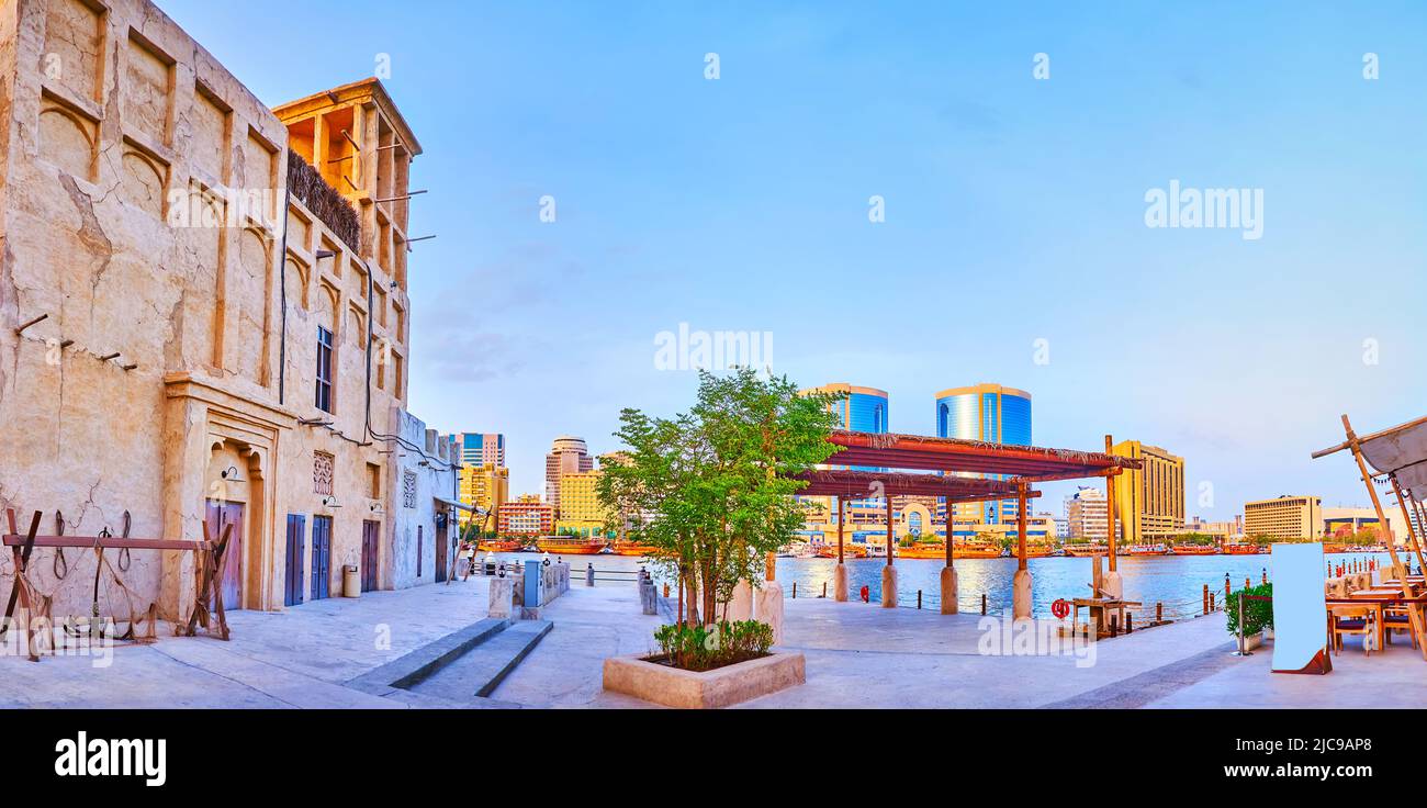 Panoramic view of embankment of Al Seef neighborhood with vintage house, and a view on Dubai ...