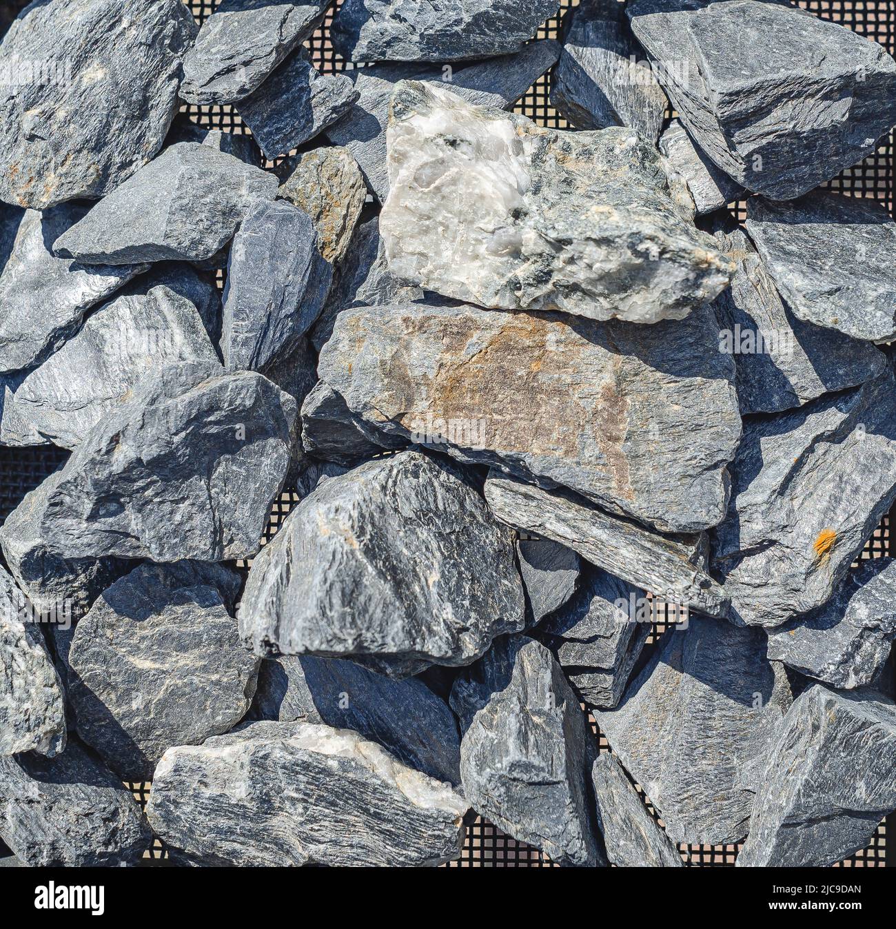 Big rubble. Gray stone for construction. Construction site. Crushed ...