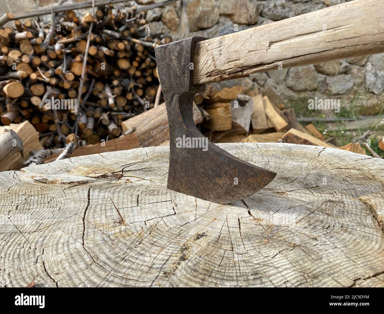 Axe cut in the chopping block. preparing for winter concept. firewood ...