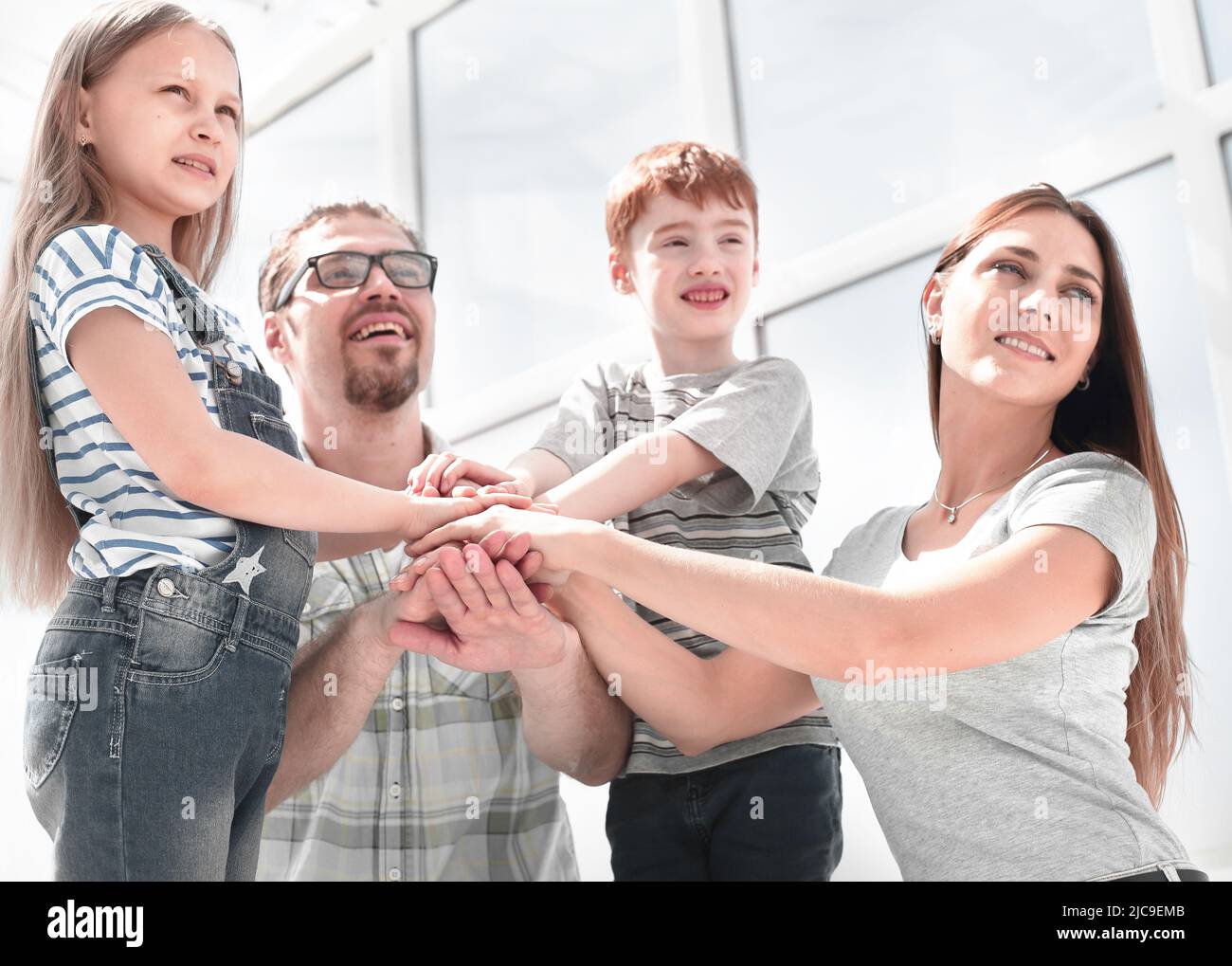 close up. a happy family looks forward to something Stock Photo - Alamy