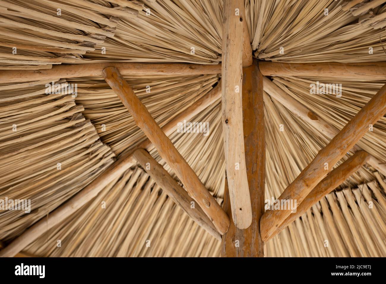 Wooden wicker beach umbrella closeup. Textured background Stock Photo ...