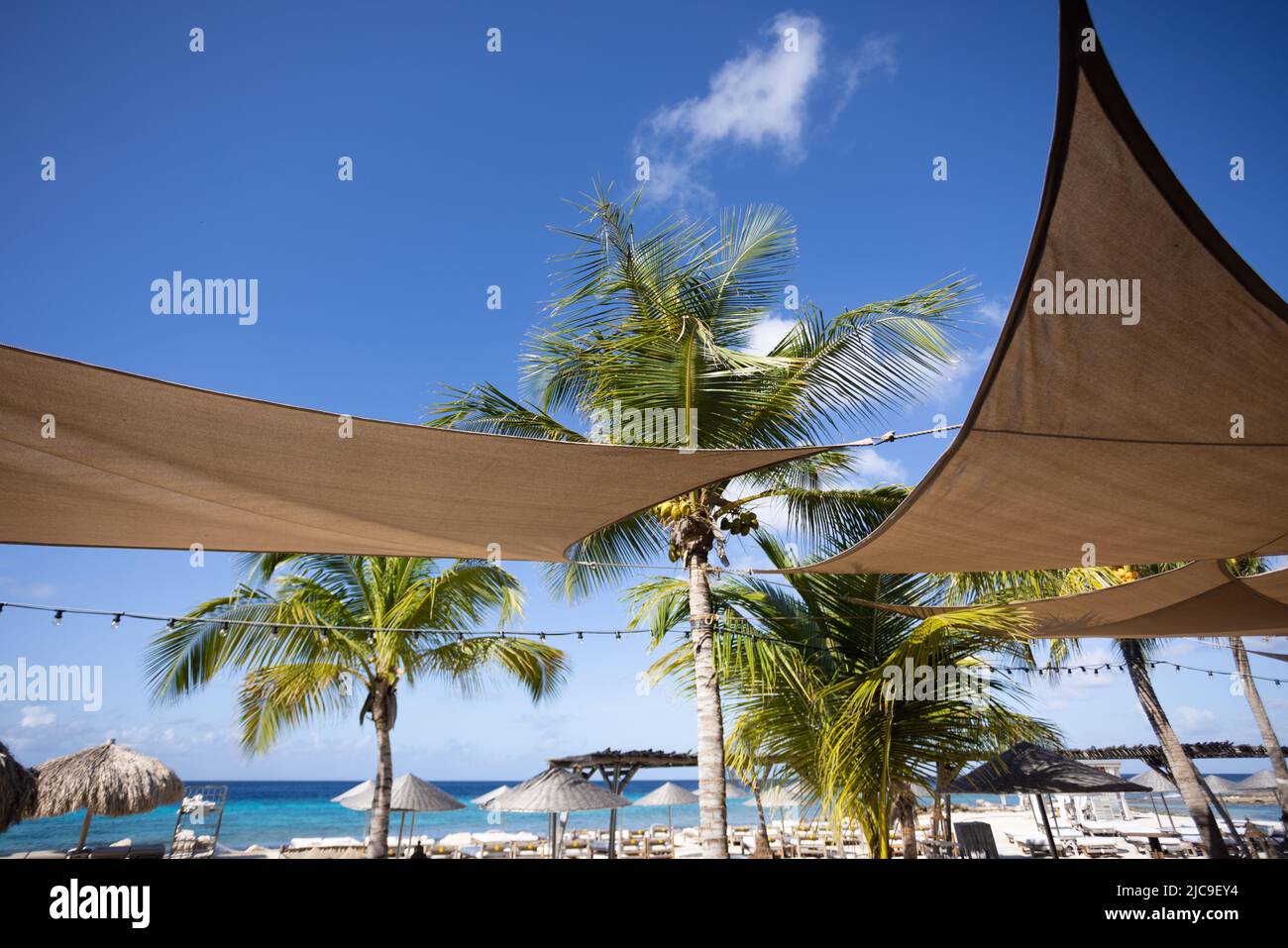 Awning to make shadow at beach club Stock Photo - Alamy