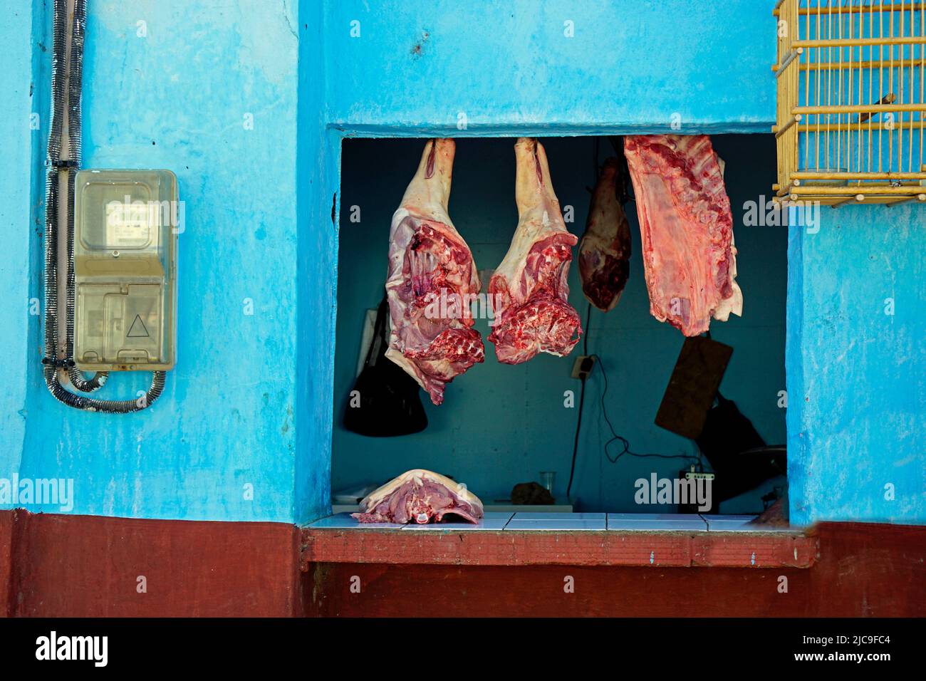 butchershop selling fresh meat through a open window Stock Photo - Alamy