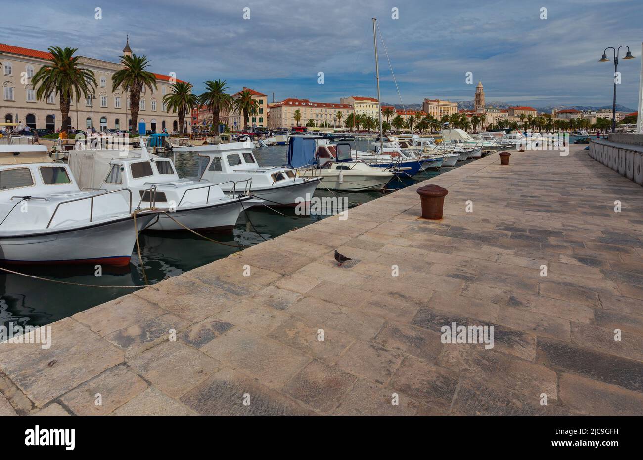 Scenic view of the city promenade and harbor on a sunny day. Split ...