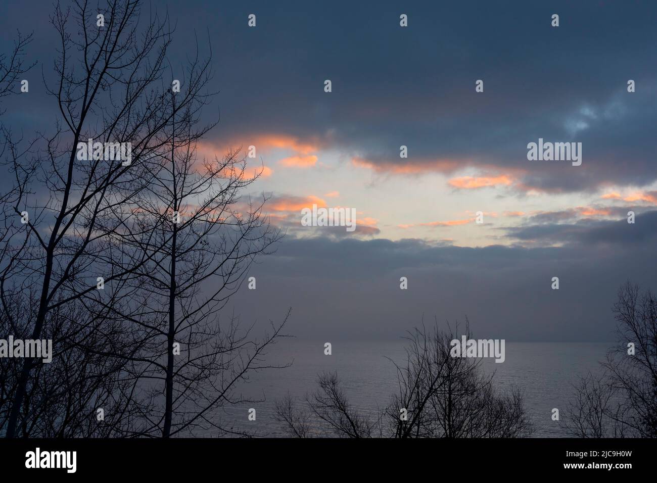 Lake Huron landscape where a break in the clouds allows the Sunrise ...