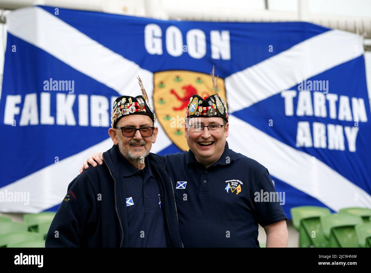 Scotland supporters pose for a photograph in front of a flag before the ...
