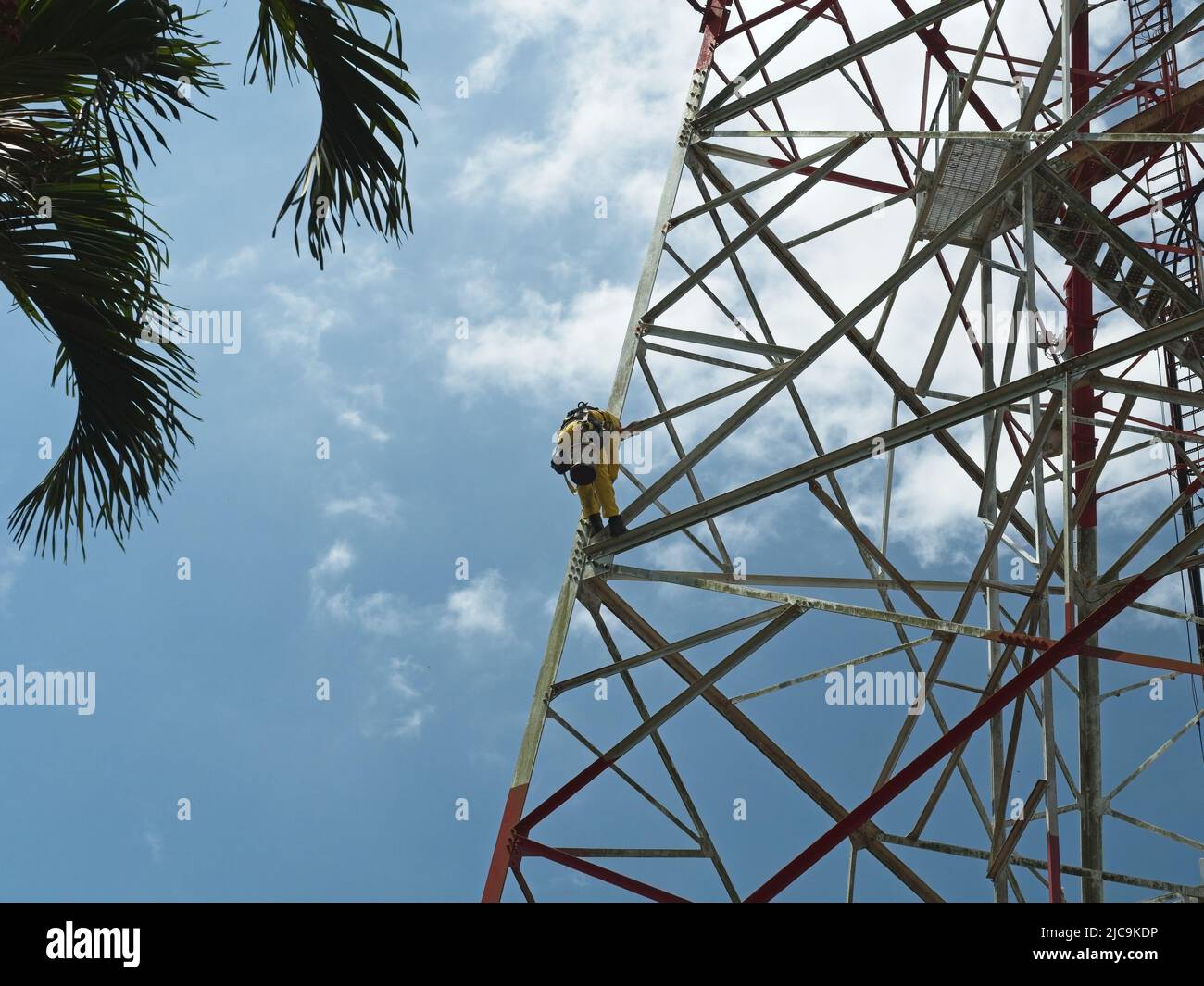 A maintenance worker on a communication tower Stock Photo - Alamy