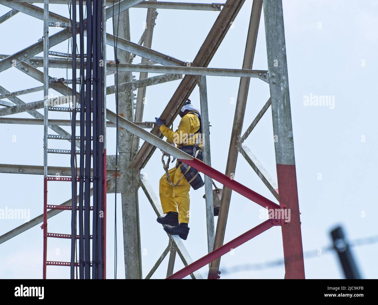 A maintenance worker on a communication tower Stock Photo - Alamy