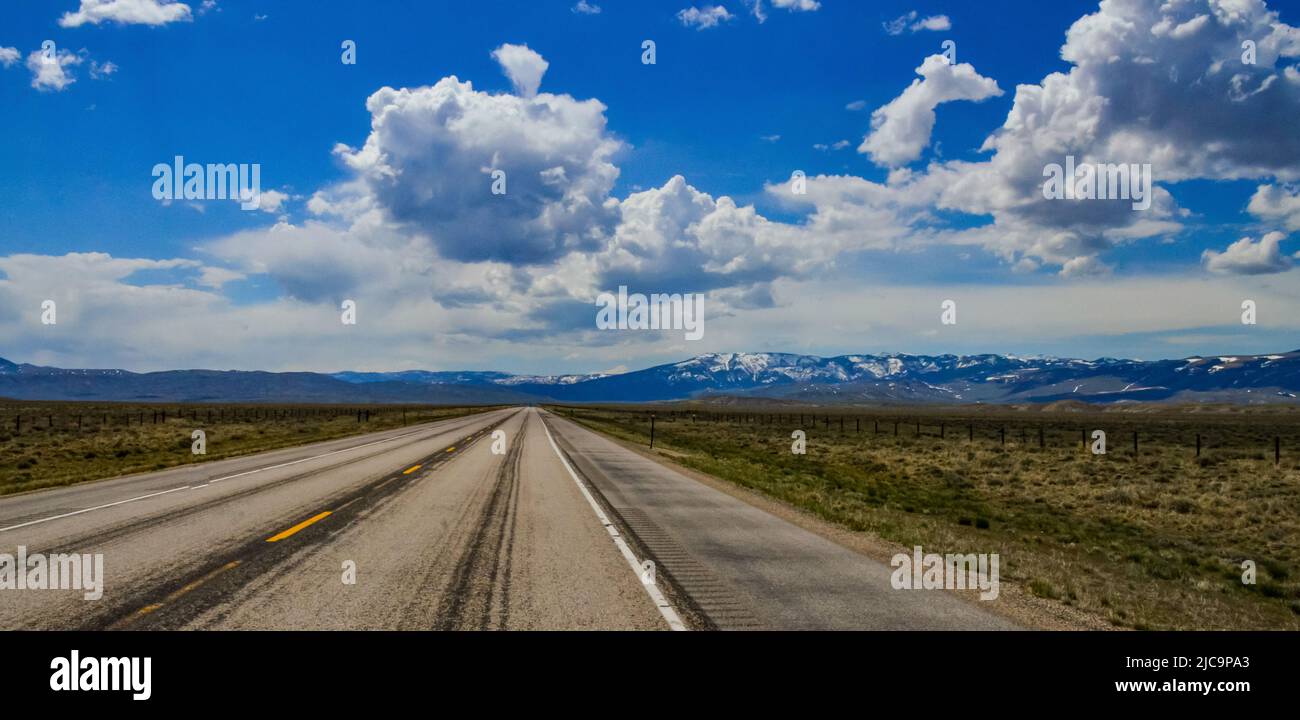 The landscape is in the wild. A road going into the distance, white ...