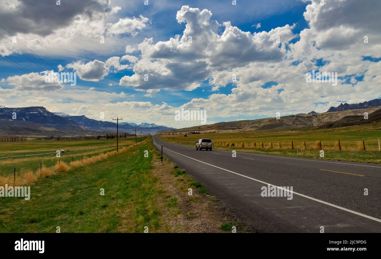 The landscape is in the wild. A road going into the distance, white ...