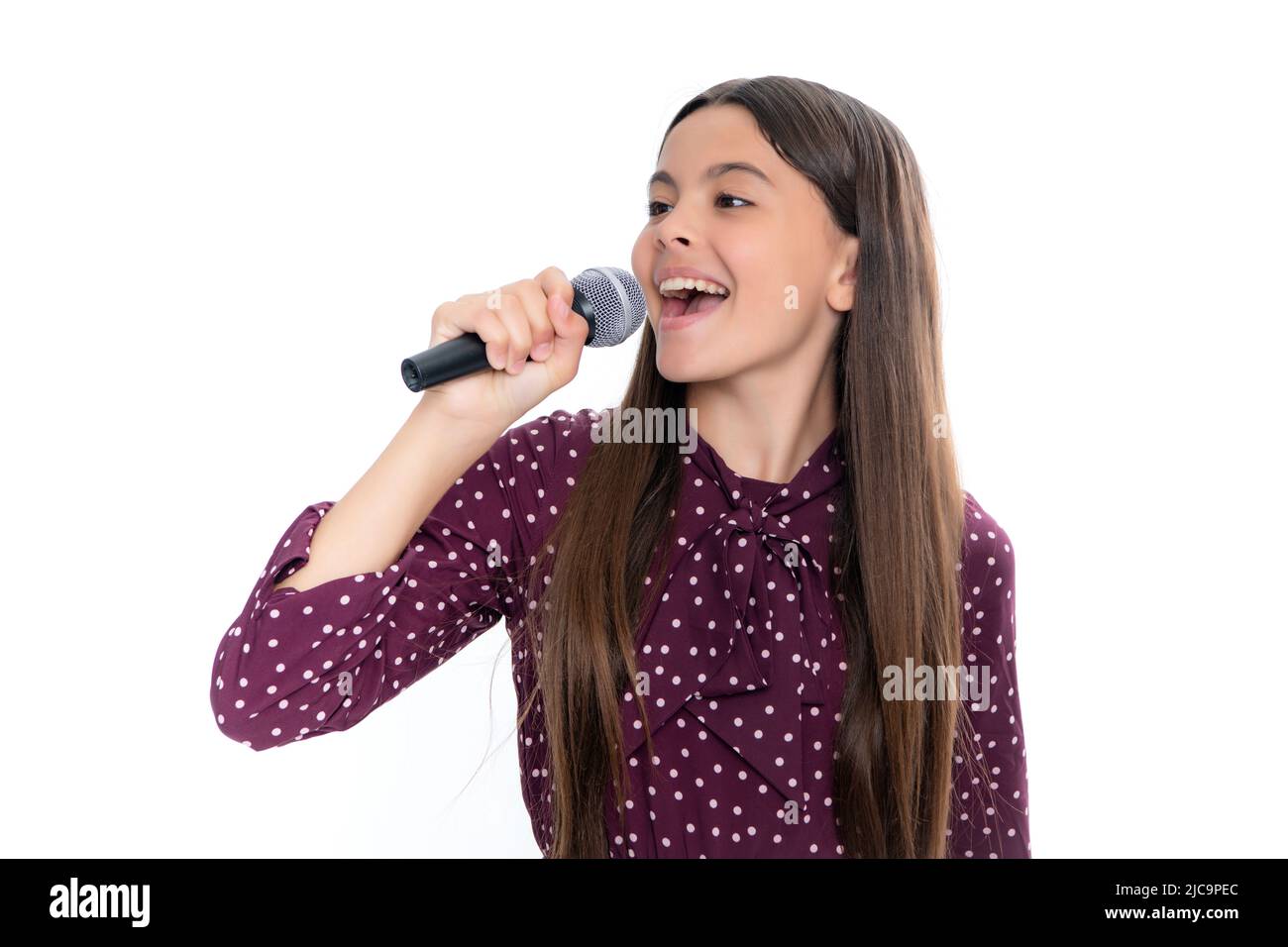 Teenager singing with a microphone. Karaoke singer. Teen girl sings ...