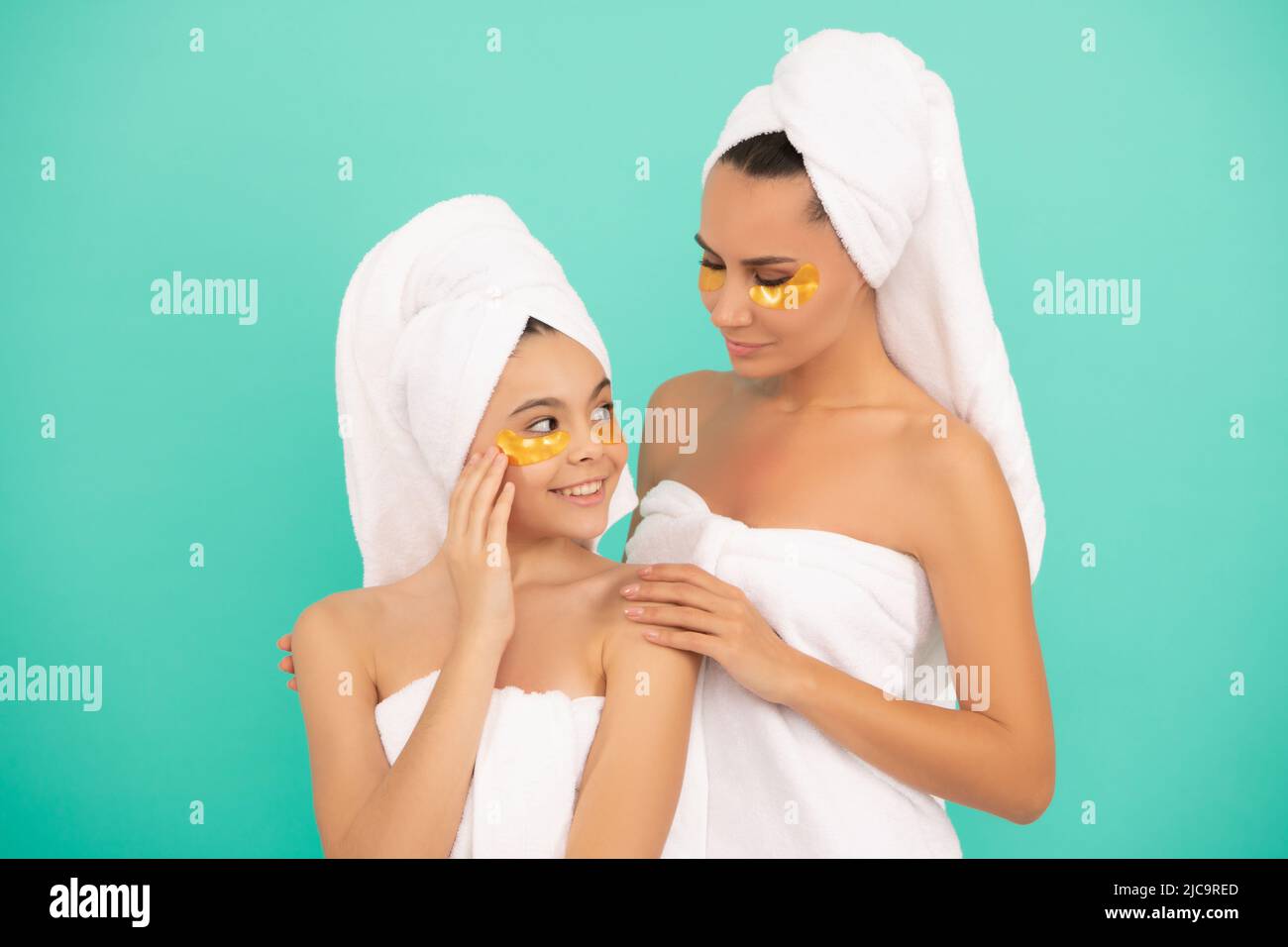 family spa of mother and daughter with facial patch Stock Photo - Alamy
