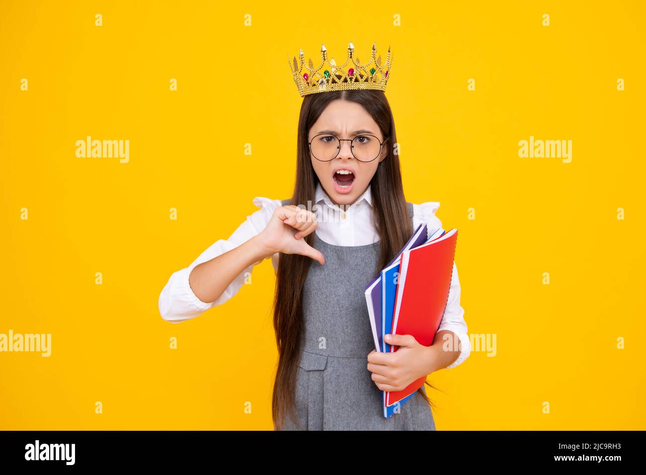 Excited teenager princess in school uniform and crown celebrating ...