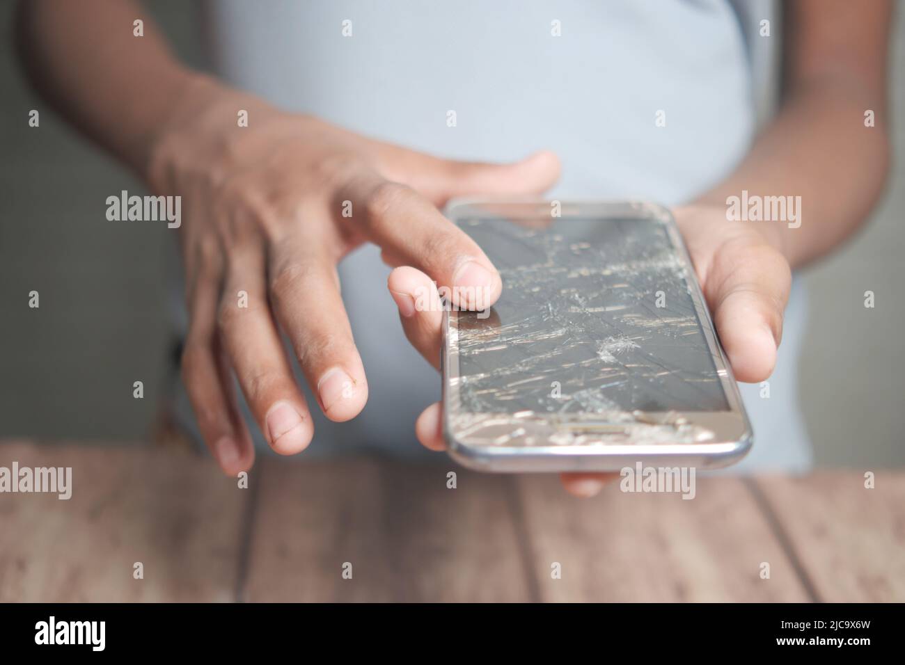 Man hand holding broken smart hi-res stock photography and images - Alamy