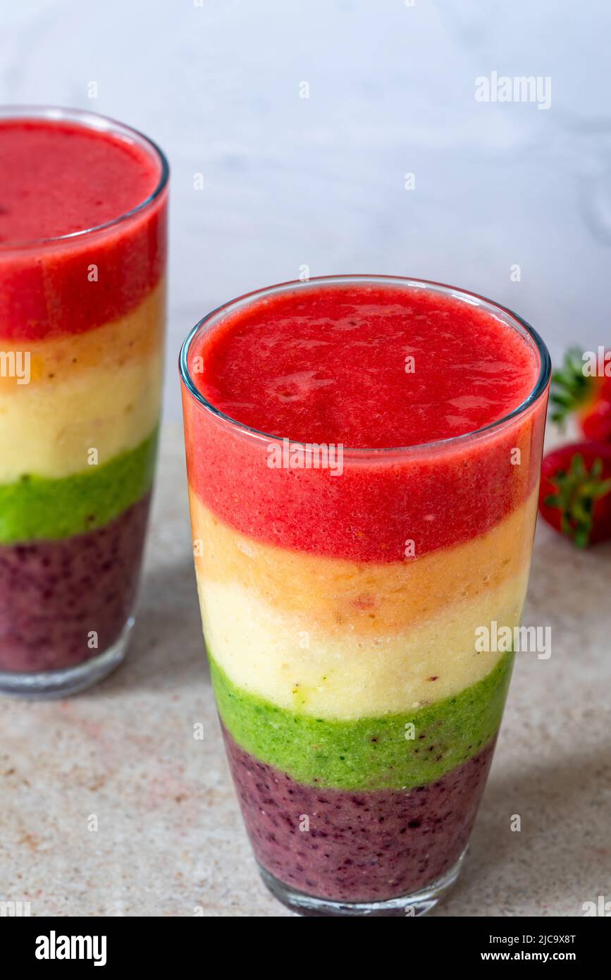 Colorful rainbow leyered fruit smoothie Stock Photo - Alamy