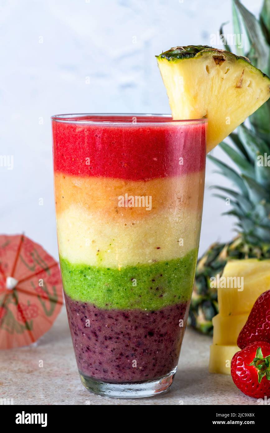 Colorful rainbow leyered fruit smoothie Stock Photo - Alamy