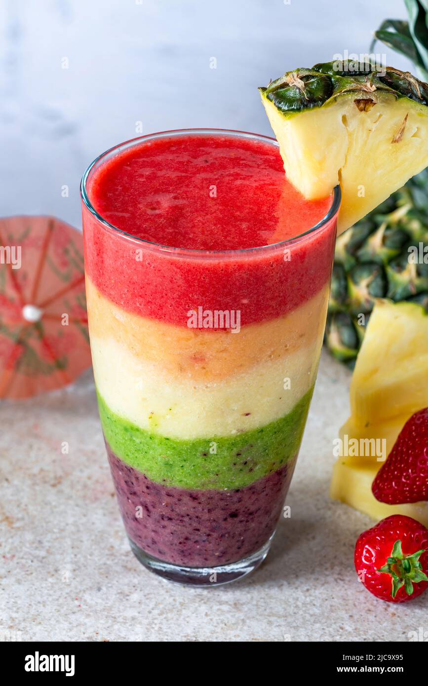 Colorful rainbow leyered fruit smoothie Stock Photo - Alamy