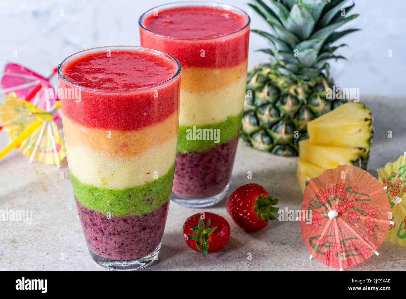 Colorful rainbow leyered fruit smoothie Stock Photo - Alamy