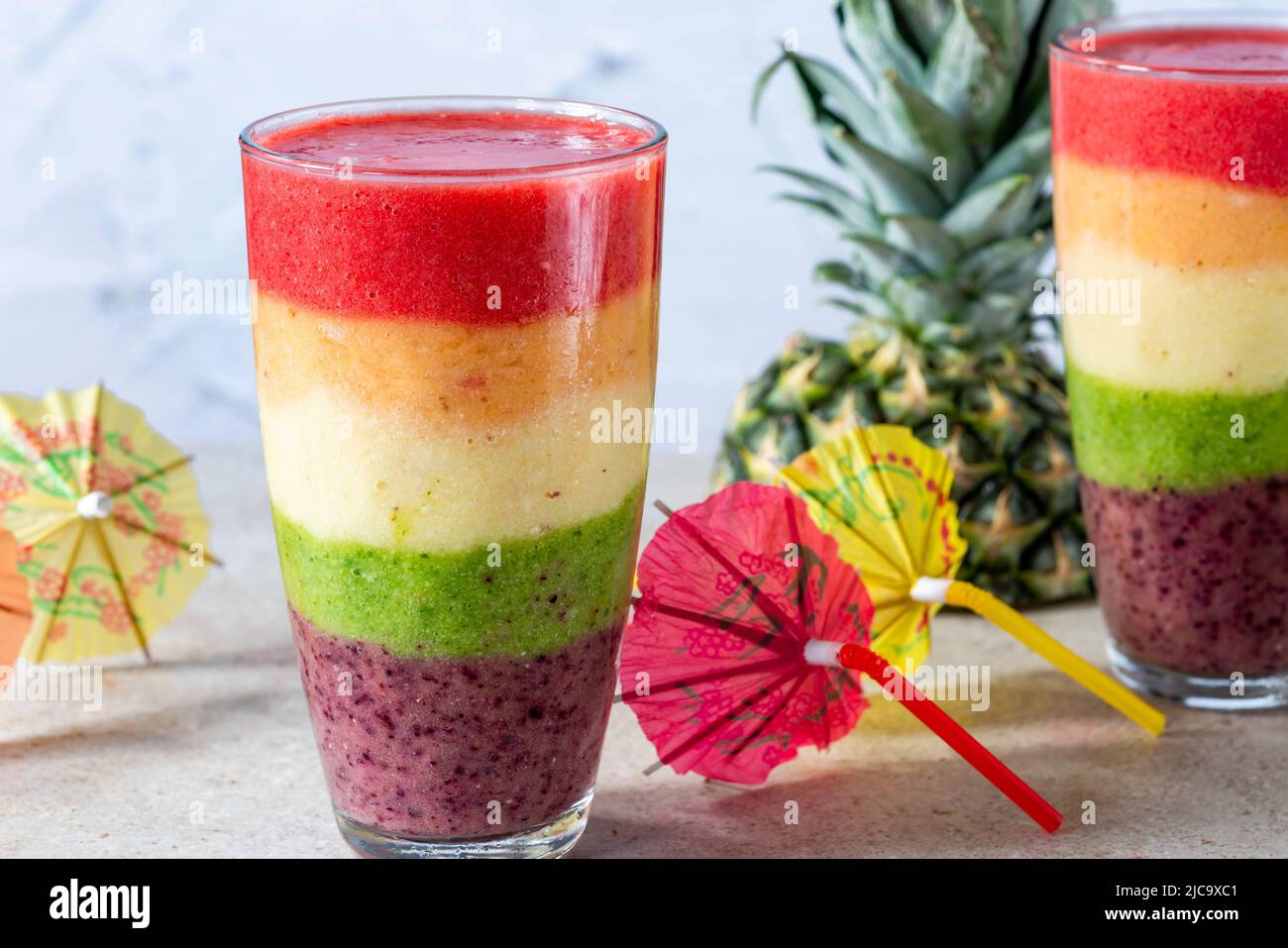 Colorful rainbow leyered fruit smoothie Stock Photo - Alamy