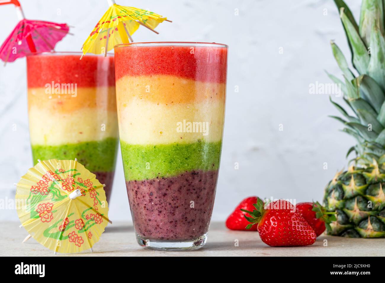 Colorful rainbow leyered fruit smoothie Stock Photo - Alamy