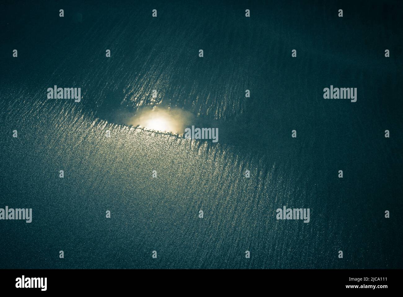 Sun Reflection On Sand Stock Photo - Alamy