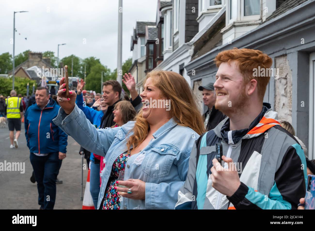 Strathaven, Scotland, UK. 11th June, 2022. Members of the public watch ...