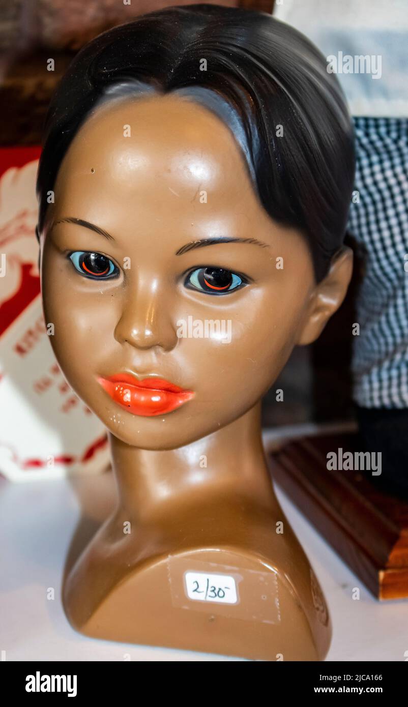 Closeup of chipped painted Hawaiian girl with painted eyes and grey in ...