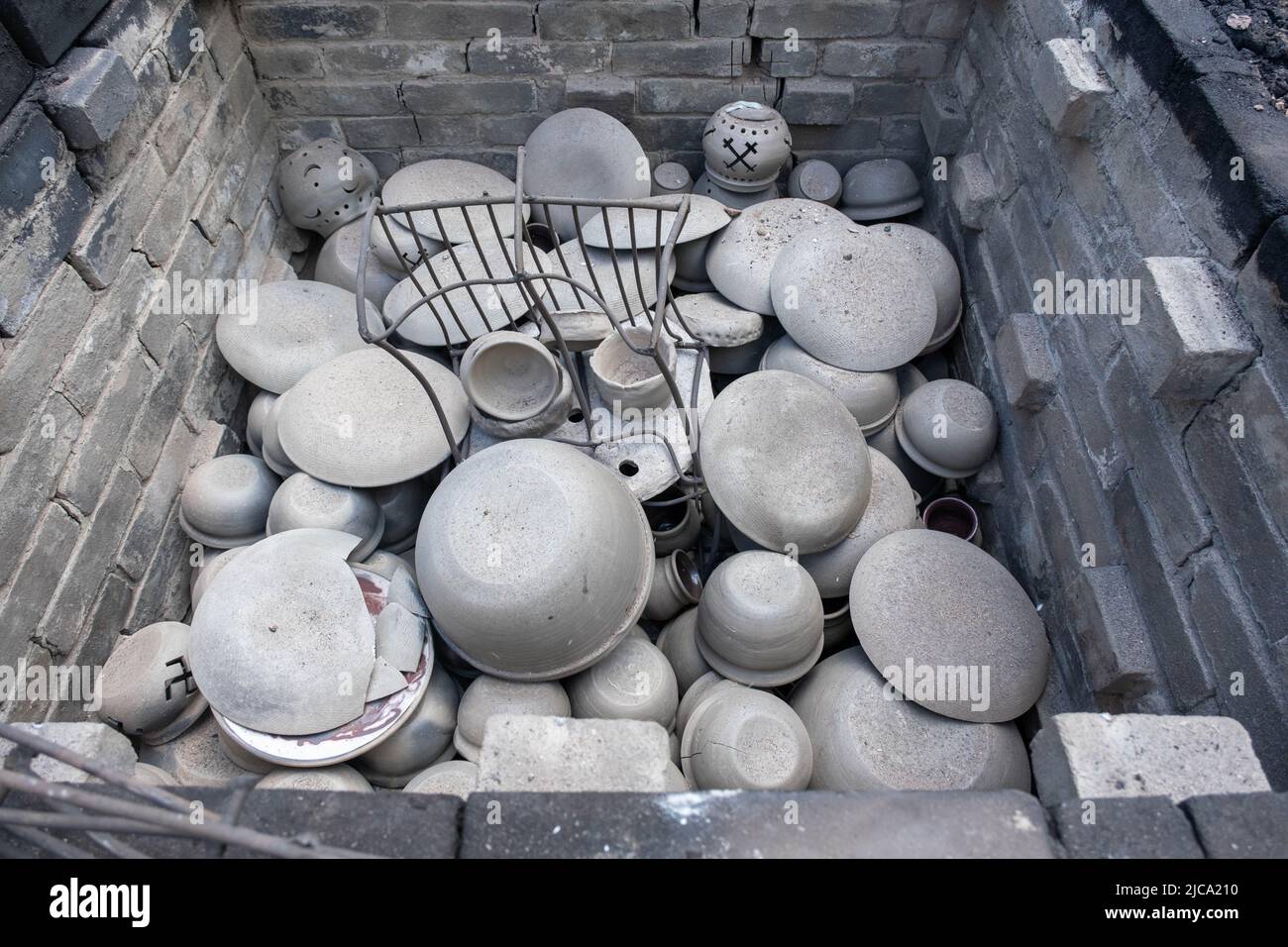 opening of a ceramic kiln, Unique handmade pots and dishes of clay ...