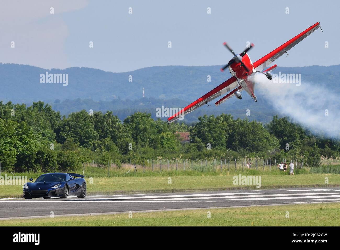 Peter Podlunsek, an experienced Red Bull acrobatic pilot, flew over ...