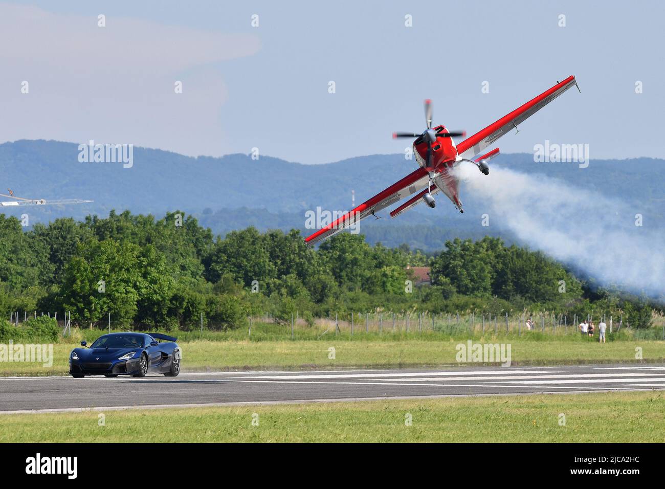 Peter Podlunsek, an experienced Red Bull acrobatic pilot, flew over ...