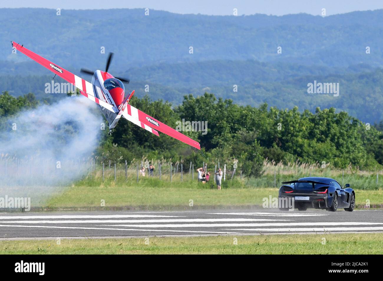 Peter Podlunsek, an experienced Red Bull acrobatic pilot, flew over ...