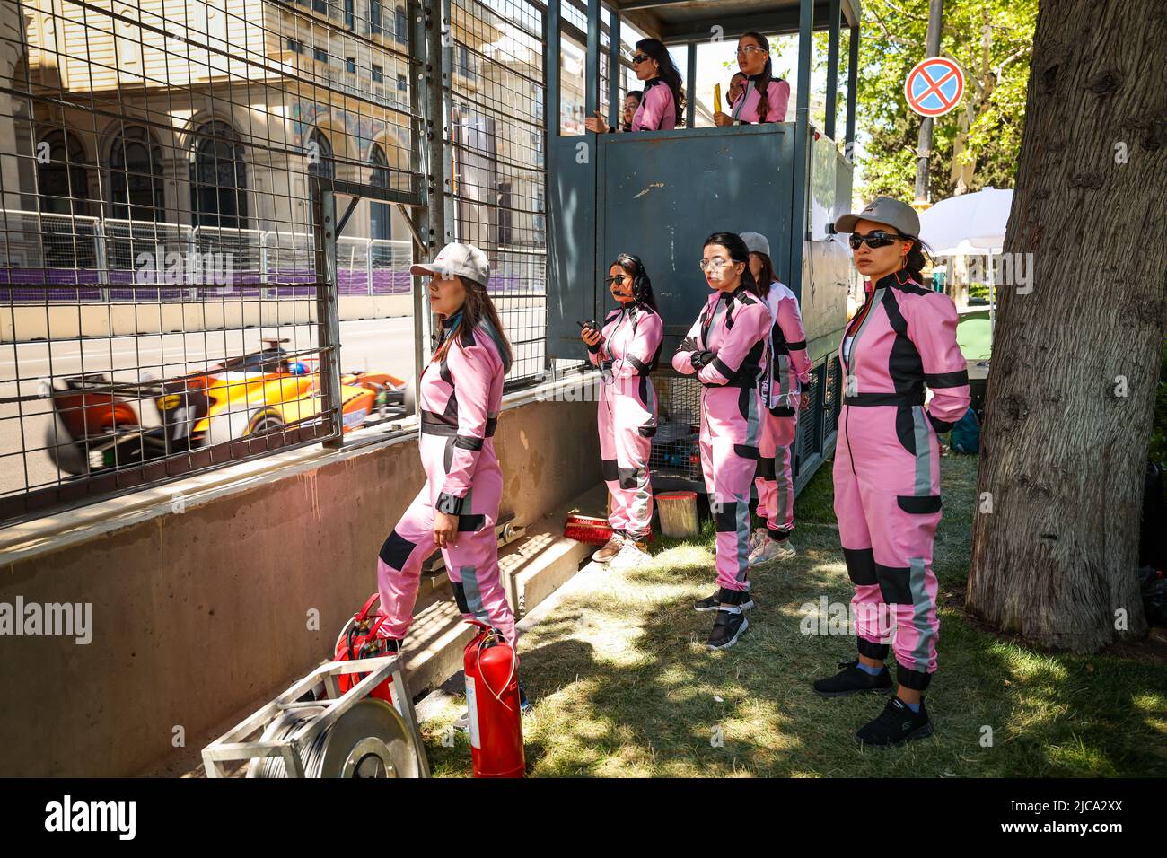 The women only marshals post alongside the track during the 6th round ...