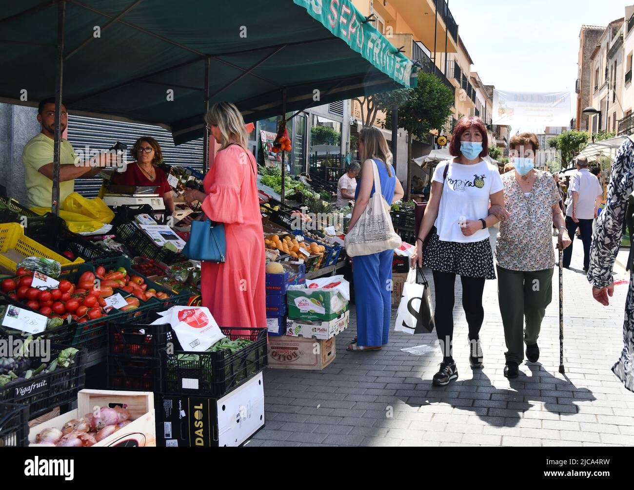 Palafrugel street market in Spain with some customers wearing Covid 19 ...