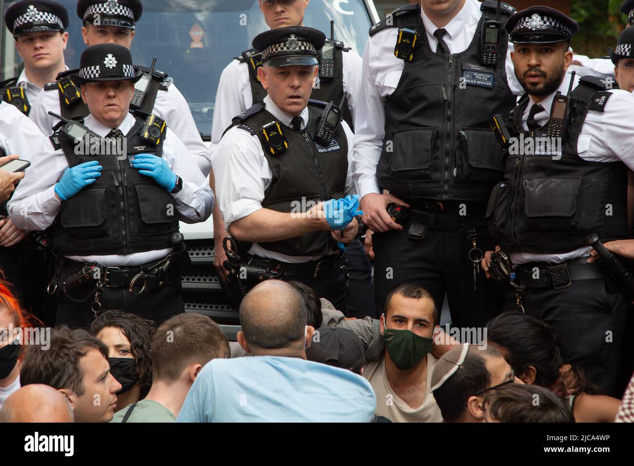 London, UK. 11th June 2022. People clash with police during a ...