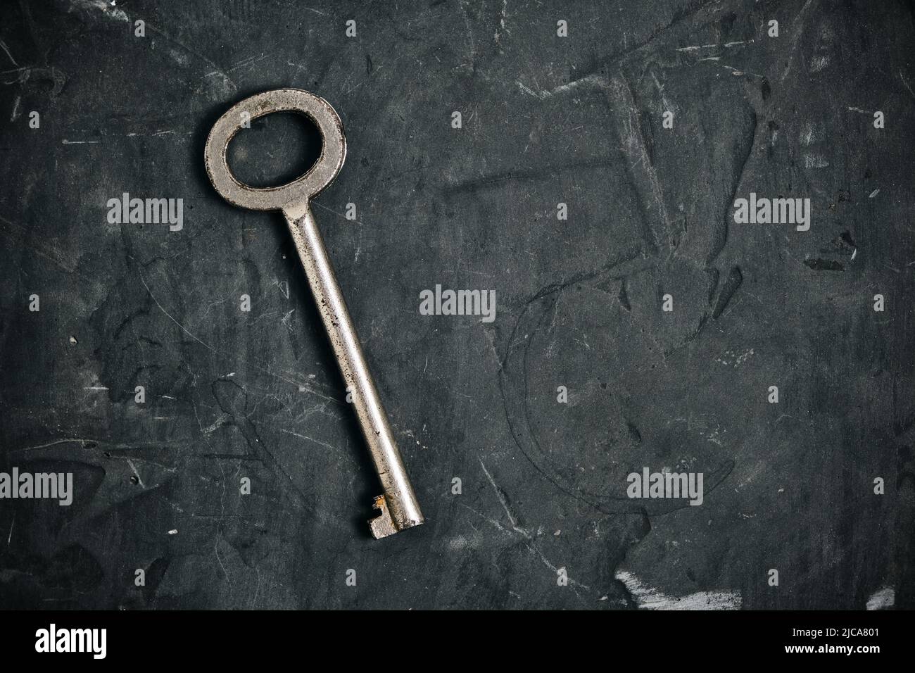 Old, retro vintage key dark background Stock Photo - Alamy
