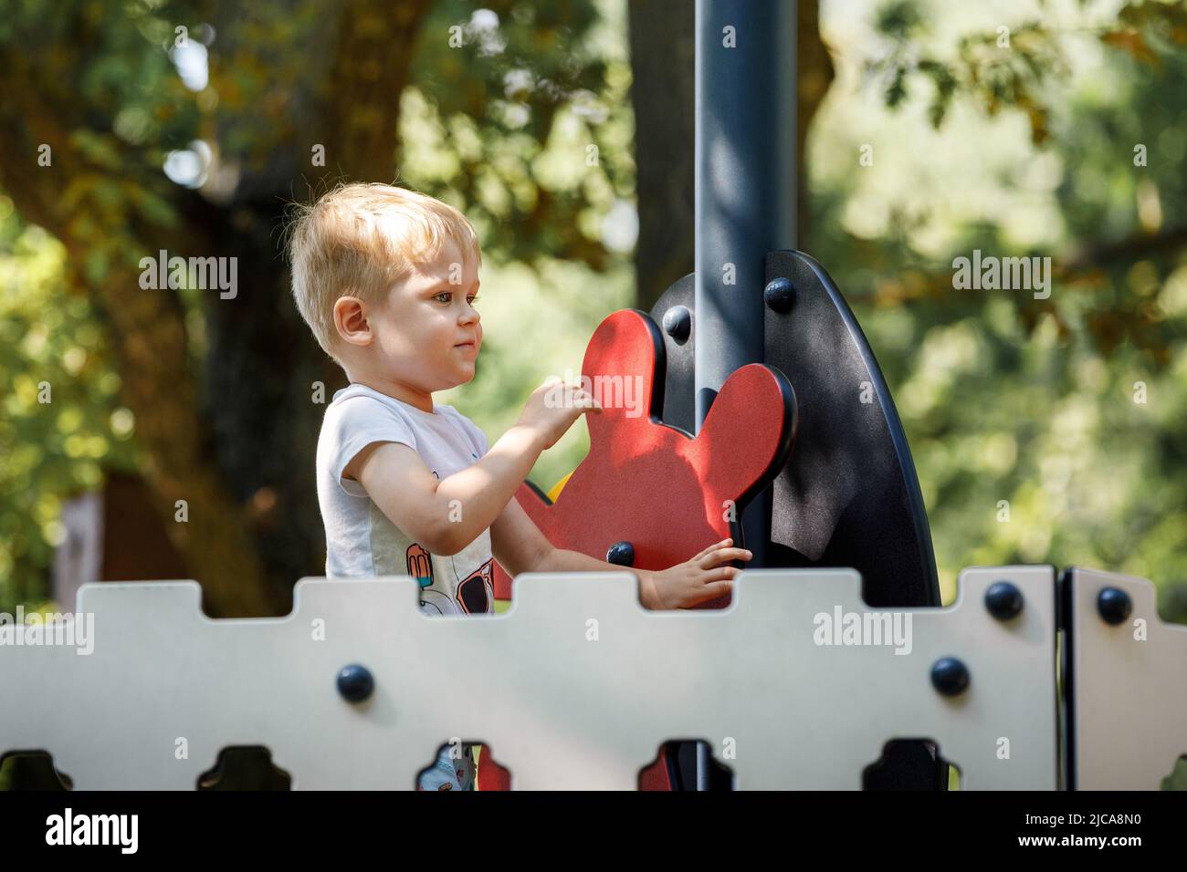 The brave little boy plays the captain of the ship, he turns the red ...