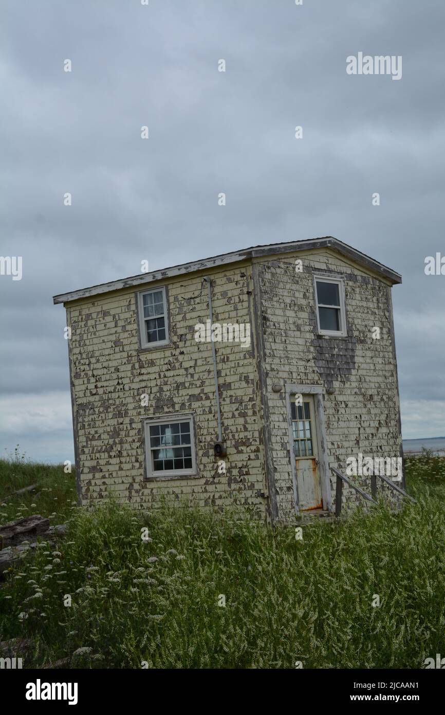 Window and yellow siding at old seaside building Stock Photo - Alamy